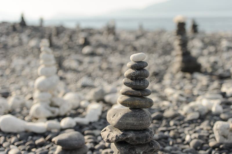 Stacked Stones on a Background of Beach Stock Image - Image of ...