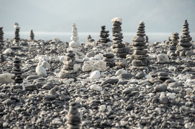 Stack of Stones on the Beach and Sea Background Stock Image - Image of ...