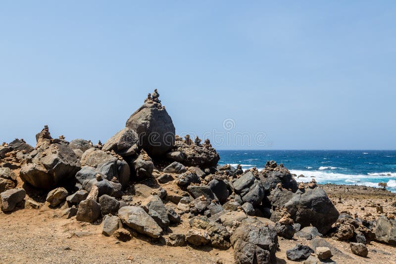 Stacked Stones on Black Iron Stock Image - Image of sand, shore: 57260331