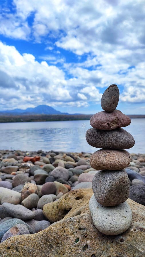 Stacked Stones on the Edge of the Beach Stock Image - Image of ocean ...