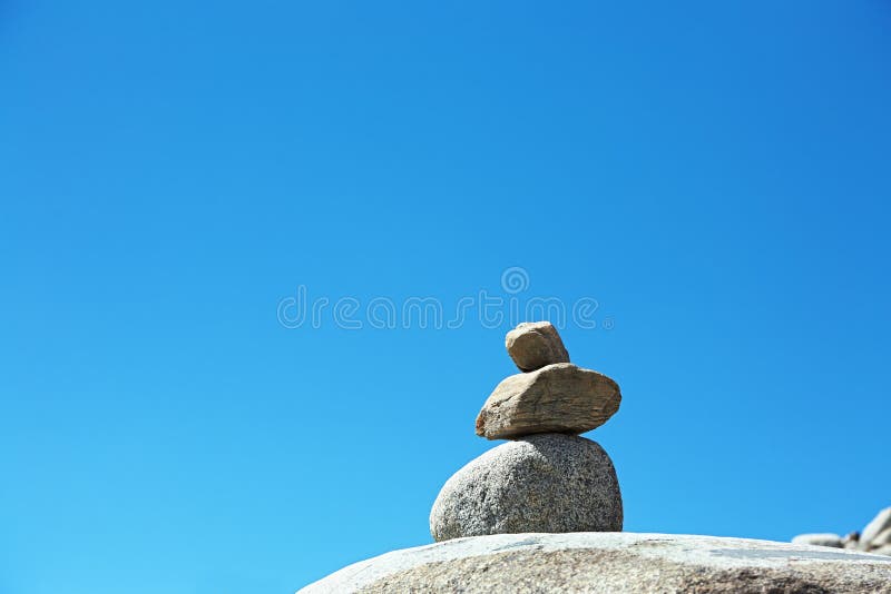 Stacked Stones in the Mountains on Sky Background Stock Photo - Image ...