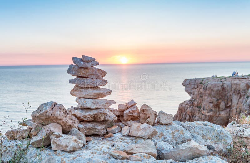 Stacked Stones Over the Sea at Sunset Stock Photo - Image of group ...