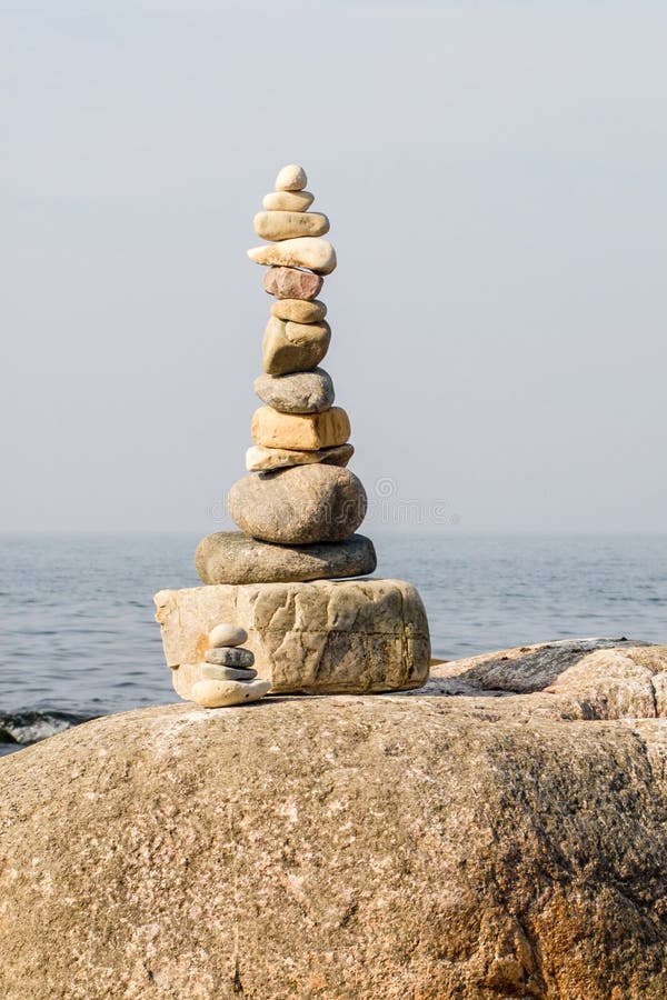 Stacked Stones with the Sea in the Background Stock Image - Image of ...
