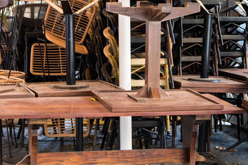 Stacked Table Seats Outside of a Closed Shop. Editorial Stock Image ...
