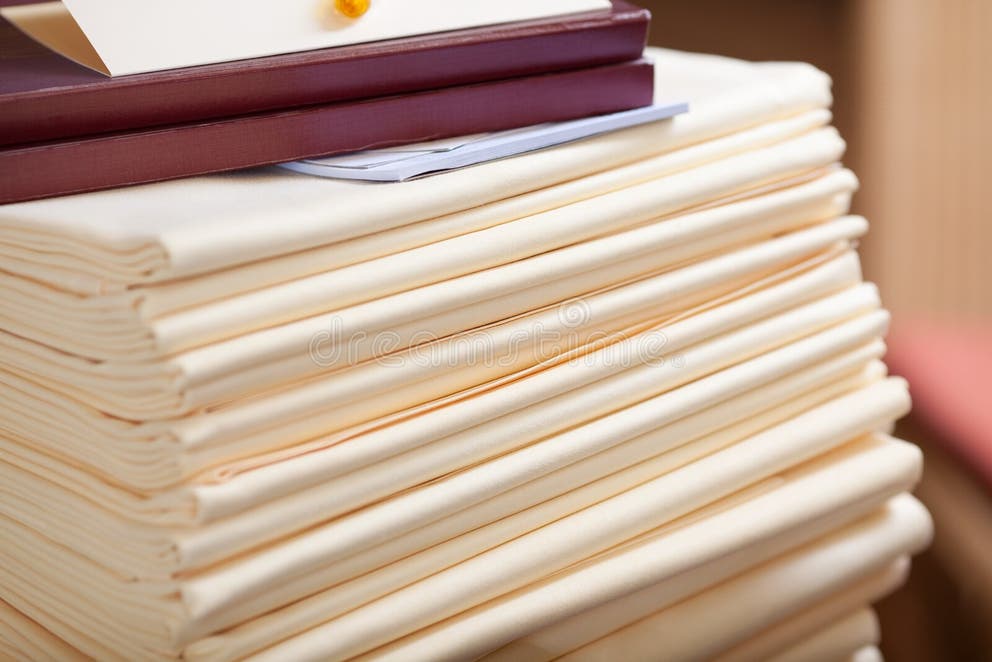 Stacked Tablecloths in Restaurant Stock Photo - Image of clean, pile ...