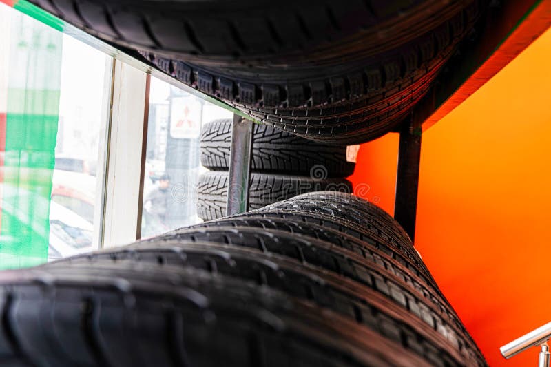 Stacked Tires in a Tire Shop Window Stock Photo - Image of vehicle ...