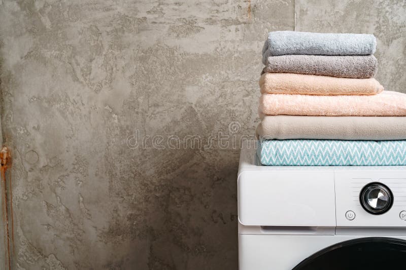Stacked Towels on Washing Machine in Laundry Room Close Up Stock Image ...