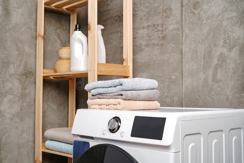 Stacked Towels on Washing Machine in Laundry Room Close Up Stock Photo ...