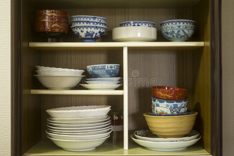Stacked various tablewares stock image. Image of order - 162569485