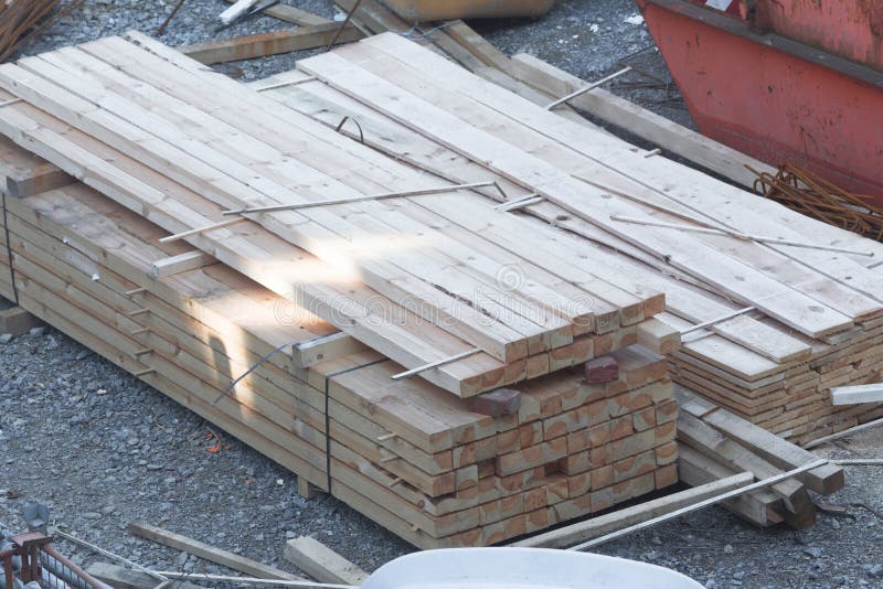 Stacked Wooden Boards at a Construction Site. Stock Image - Image of ...