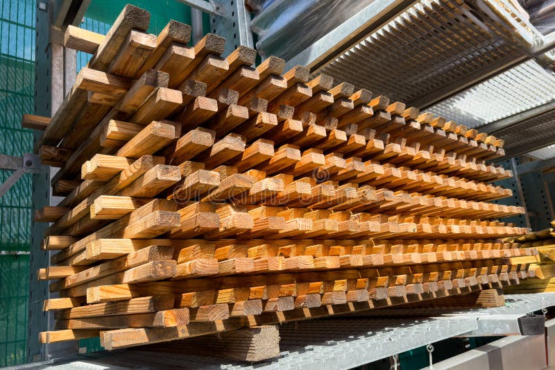 Stacked Wooden Pallets in Bright Sunlight at a Construction Site Stock ...