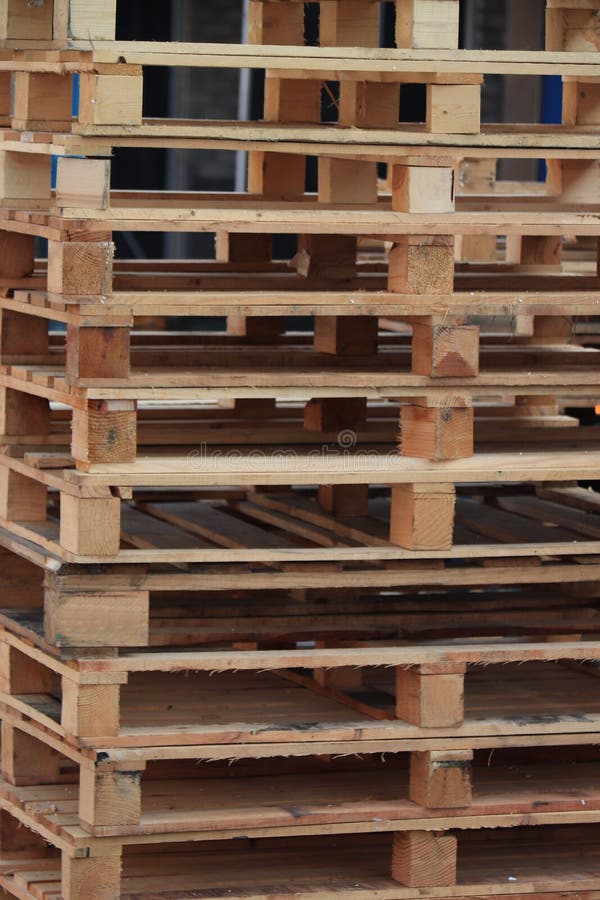 Stacked wooden pallets stock photo. Image of transport - 246465944