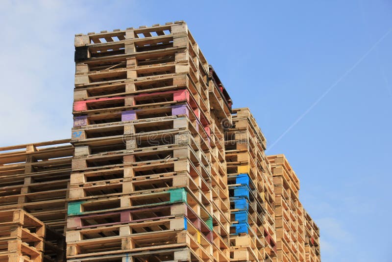 Stacked wooden pallets stock image. Image of business - 54698209