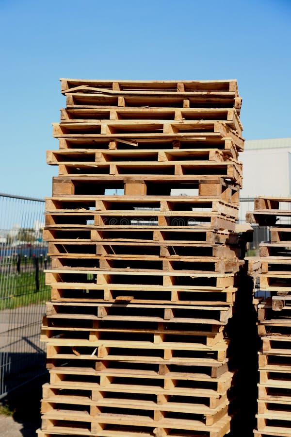 Stacked wooden pallets stock image. Image of industrial - 132500157