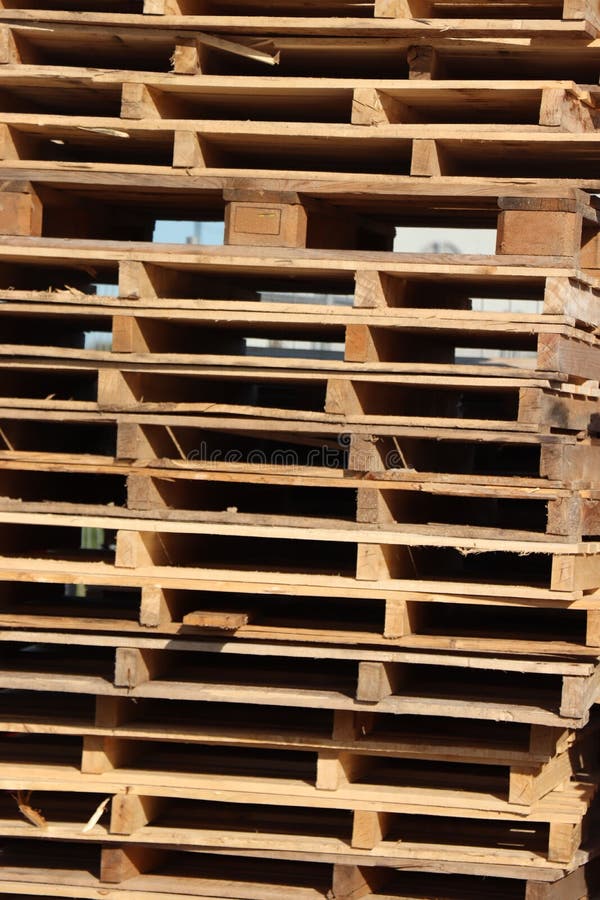 Stacked wooden pallets stock image. Image of stack, packaging - 155464949