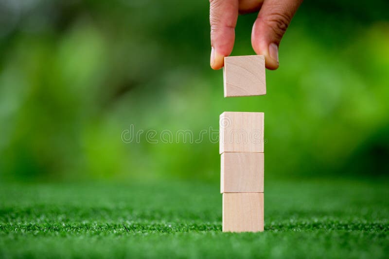 Stacking Blank Wooden Cubes on Green Background with Copy Space for ...