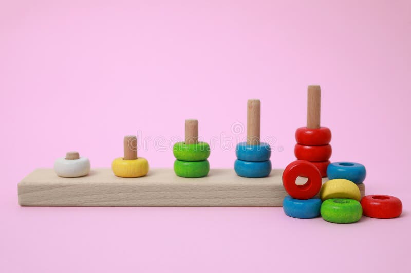 Stacking and Counting Game Wooden Pieces on Pink Background ...