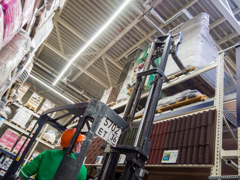 Stacking Goods on a Rack Using a Stacker Editorial Stock Photo - Image ...