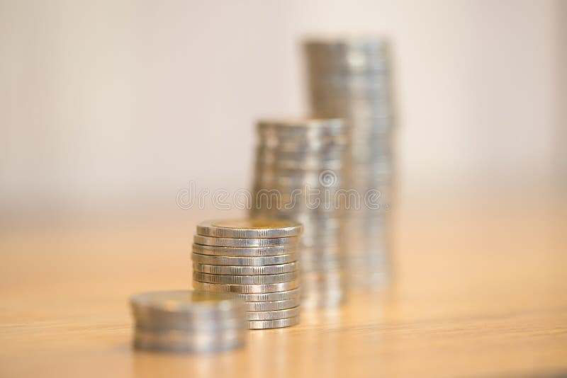 Stacking Money for Growing Chart of Coins on Wooden Desk. Stock Photo ...