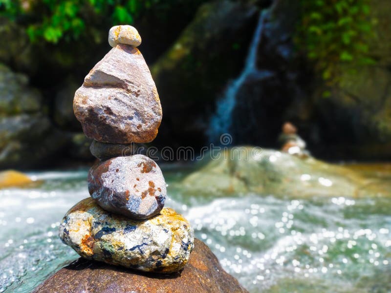 Stacking Stones on the River by the Fountain Waterfall Summer Stock ...