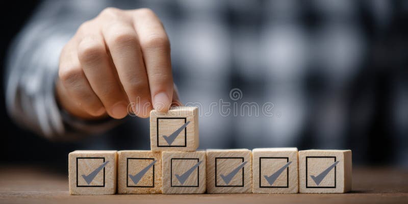 Stacking Wooden Blocks with Checkmarks in a Well-lit Workspace during ...