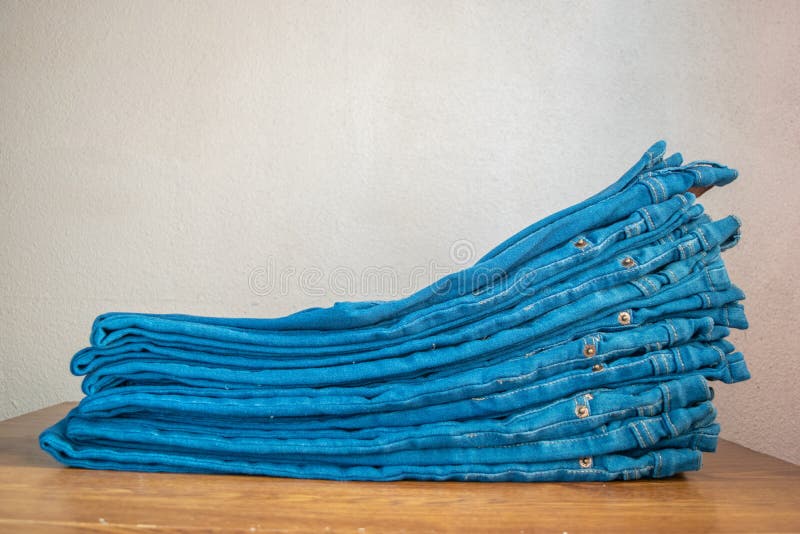 Stacks of blue jeans. stock image. Image of offer, pattern - 198617413
