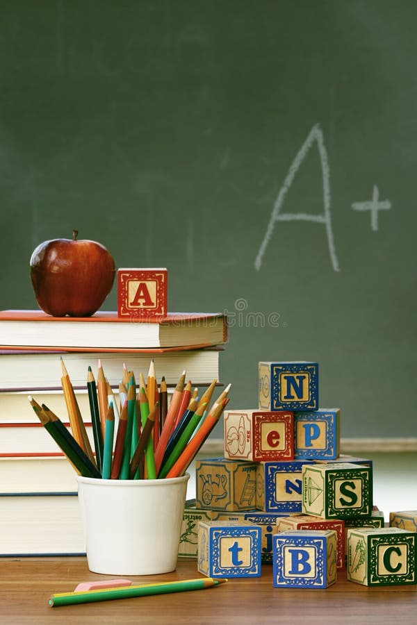 Stacks of Books with Blocks in Front of Chalkboard Stock Photo - Image ...