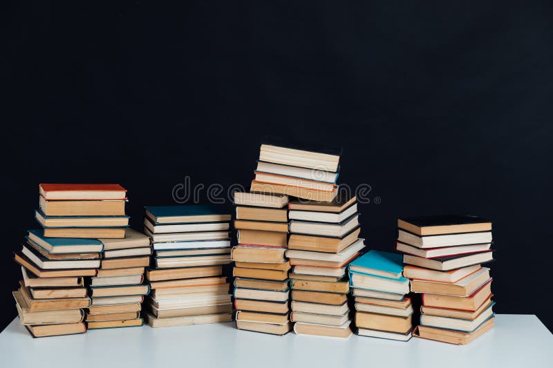 Stacks of Books for Reading and Education in College Library on Black ...