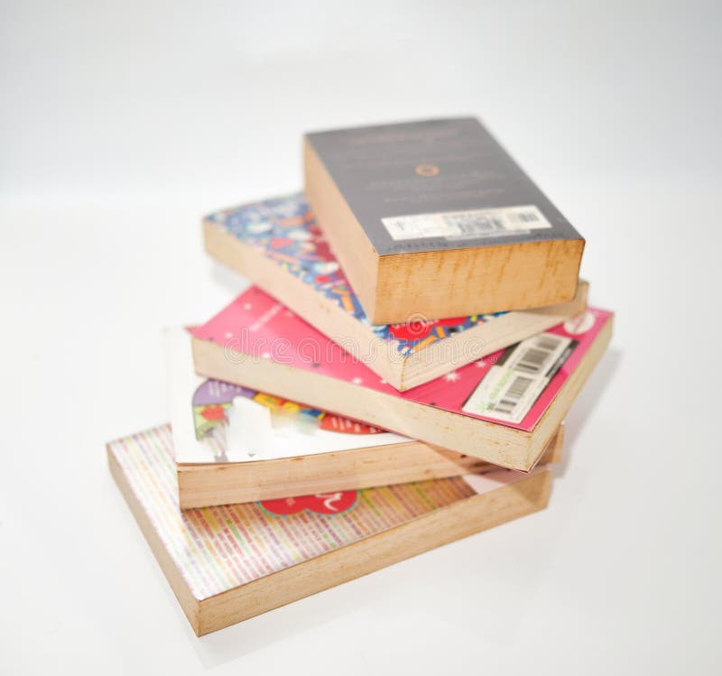 Stack of Books Arranged Horizontally on White Background Stock Photo ...