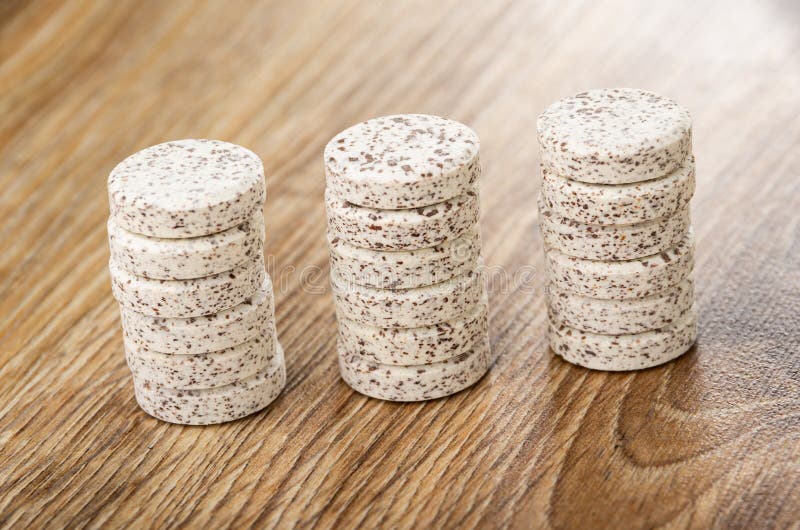 Stacks of Candy from Powdered Milk and Chocolate in Shape Tablets on ...