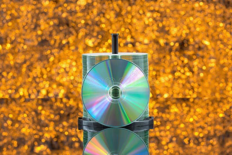Stacks of 50 CD / DVD in Orange Background Defocused Stock Photo ...