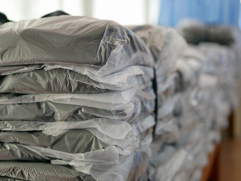 Stacks of Clothes Packed in Plastic Bags Ready To Be Shipped ...