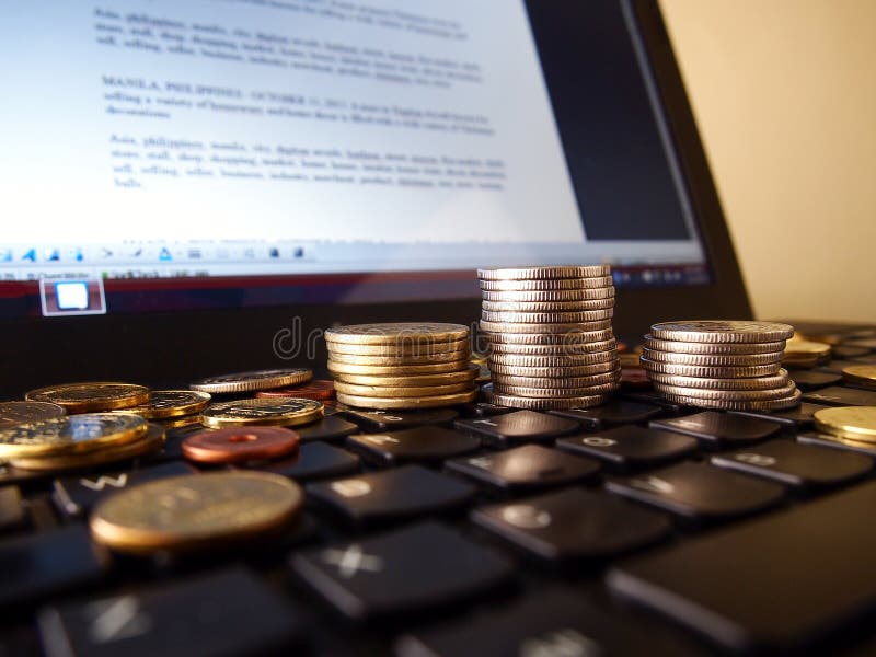 Stacks of Coins and a Laptop Computer Stock Image - Image of money ...