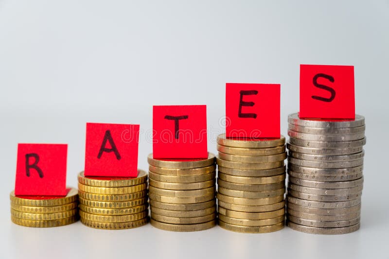 Stacks of Coins and `Rates` Text. Increase in Interest Rates. Stock ...