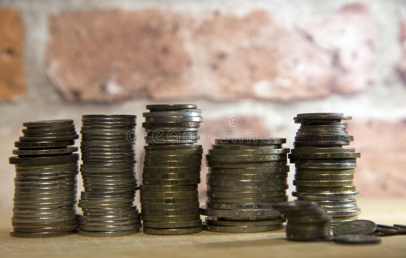 Stacks of Coins and a Vintage Brick Wall Stock Image - Image of banking ...