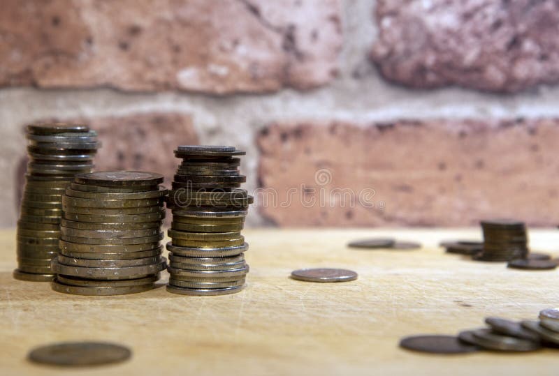 Stacks of Coins and a Vintage Brick Wall Stock Photo - Image of gold ...