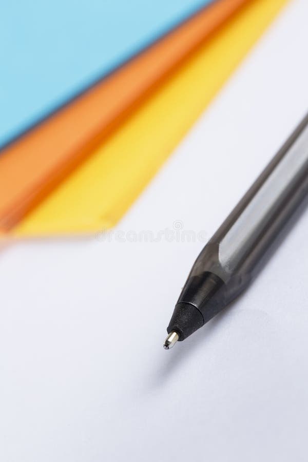Stacks of Coloured Paper on a White Table Stock Image - Image of ...