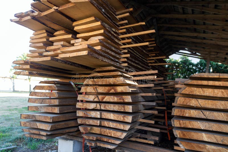 Stacks of cut wood stock photo. Image of supply, background - 195585720