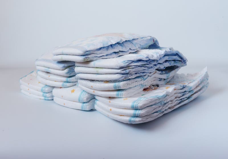 Stacks of Diapers Stacked in Staggered Rows on a White Background Stock ...