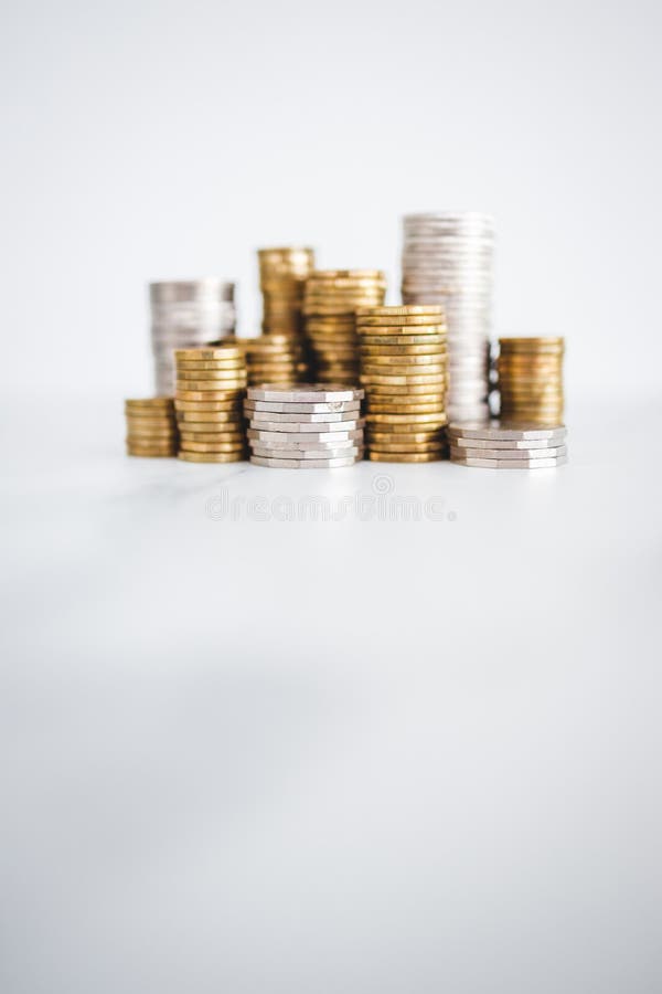 Stacks of Different Coins Shot at Shallow Depth of Field Isolated on ...