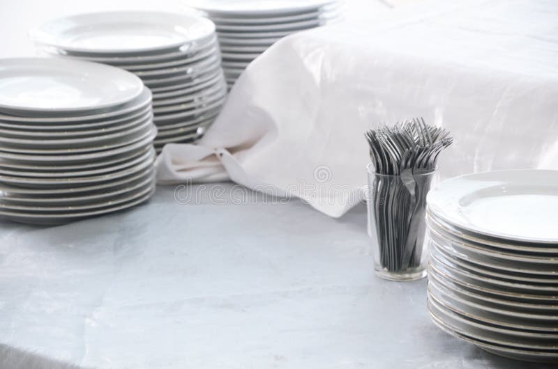 Stacks of Dishes and Forks stock photo. Image of fork - 116048702