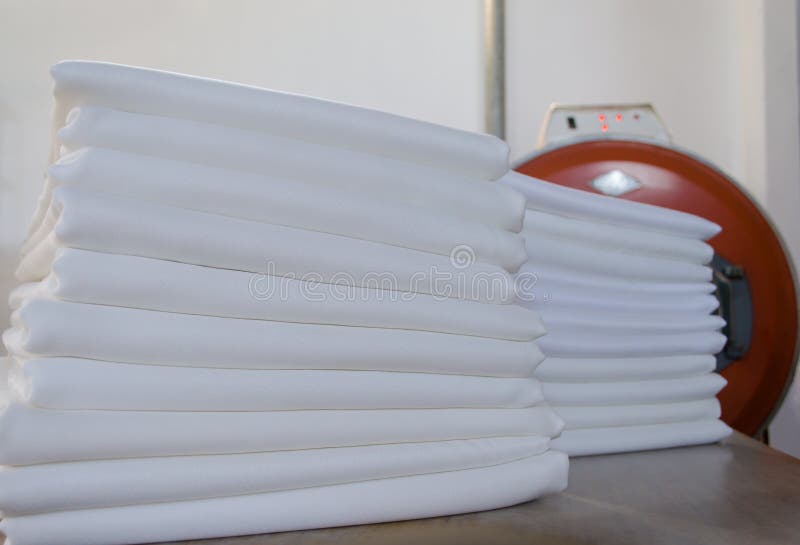 Stacks of Folded White Fabrics in a Laundry Stock Image - Image of ...