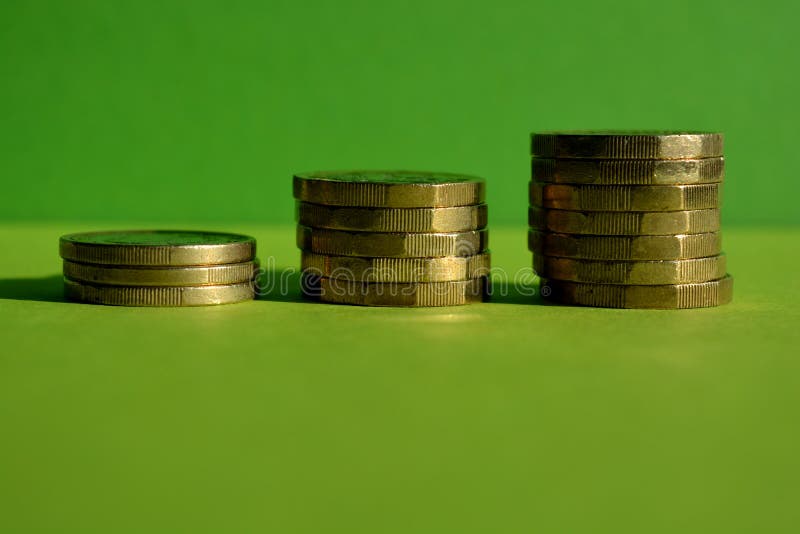 Stacks of Golden Coins on Green Stock Image - Image of fortune ...
