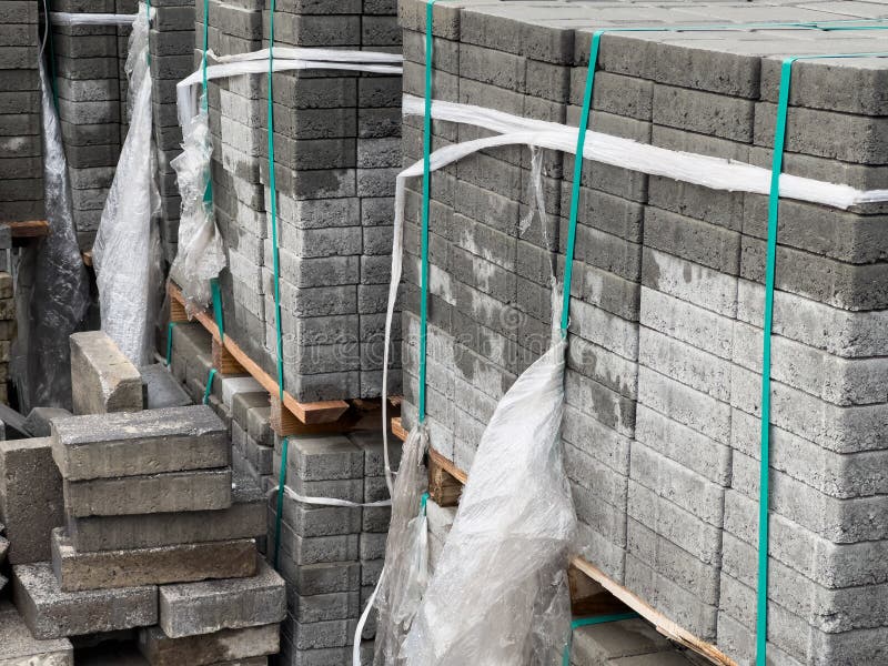 Stacks of Gray Cobblestone Blocks Secured with Plastic Wrap and Ropes ...