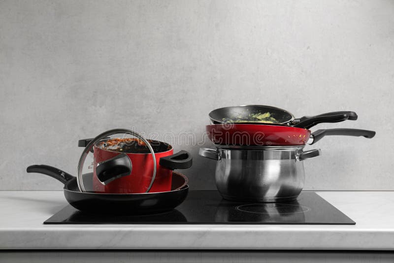 Stacks of Dirty Kitchenware on Cooktop in Kitchen Stock Image - Image ...