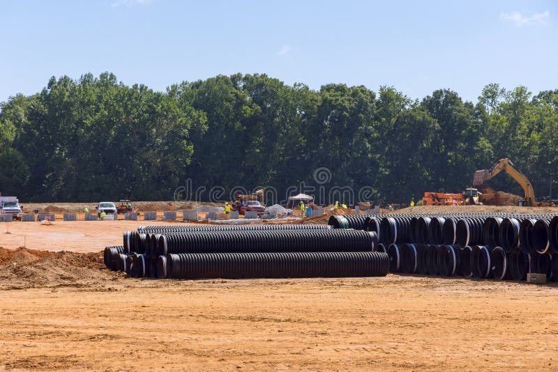 Stacks of Large Black Plastic Sewerage Pipes are Waiting To Be ...
