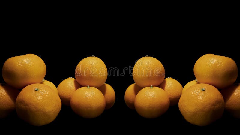 Stacks of Mandarins Isolated on a Black Background Stock Photo - Image ...