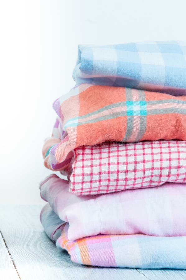 Stacks of Multicolor Clothing on White Background. Spring Concept ...