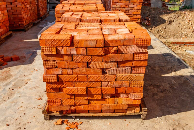 Stacks of New Red Brick at Construction Site Stock Photo - Image of ...