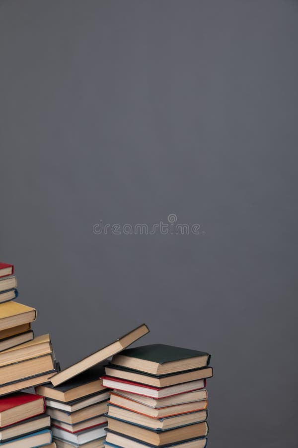 Stacks of Old Books for Teaching in the Library on a Gray Background at ...